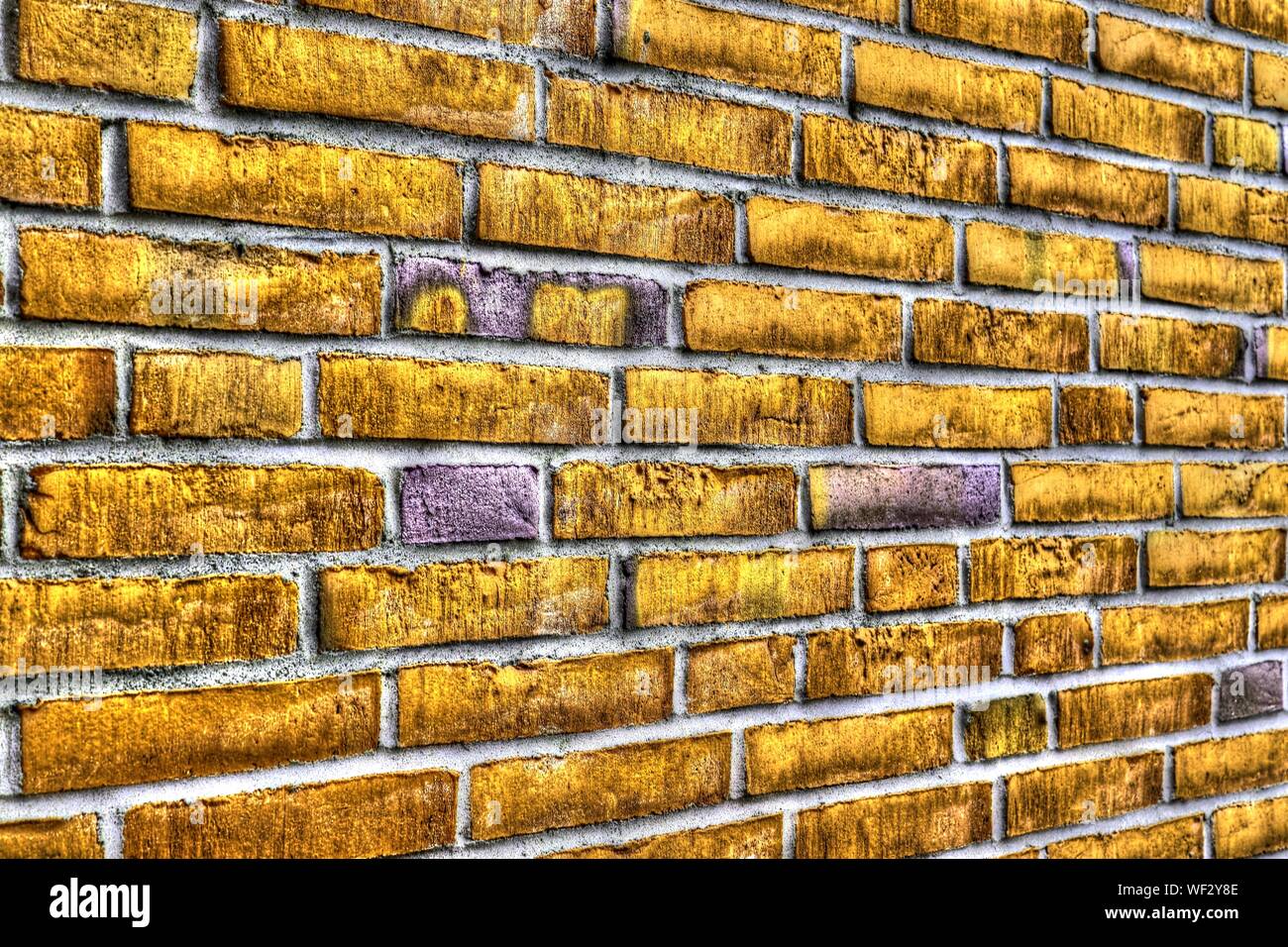 Very detailed texture of yellow brick walls on aged and weathered ...