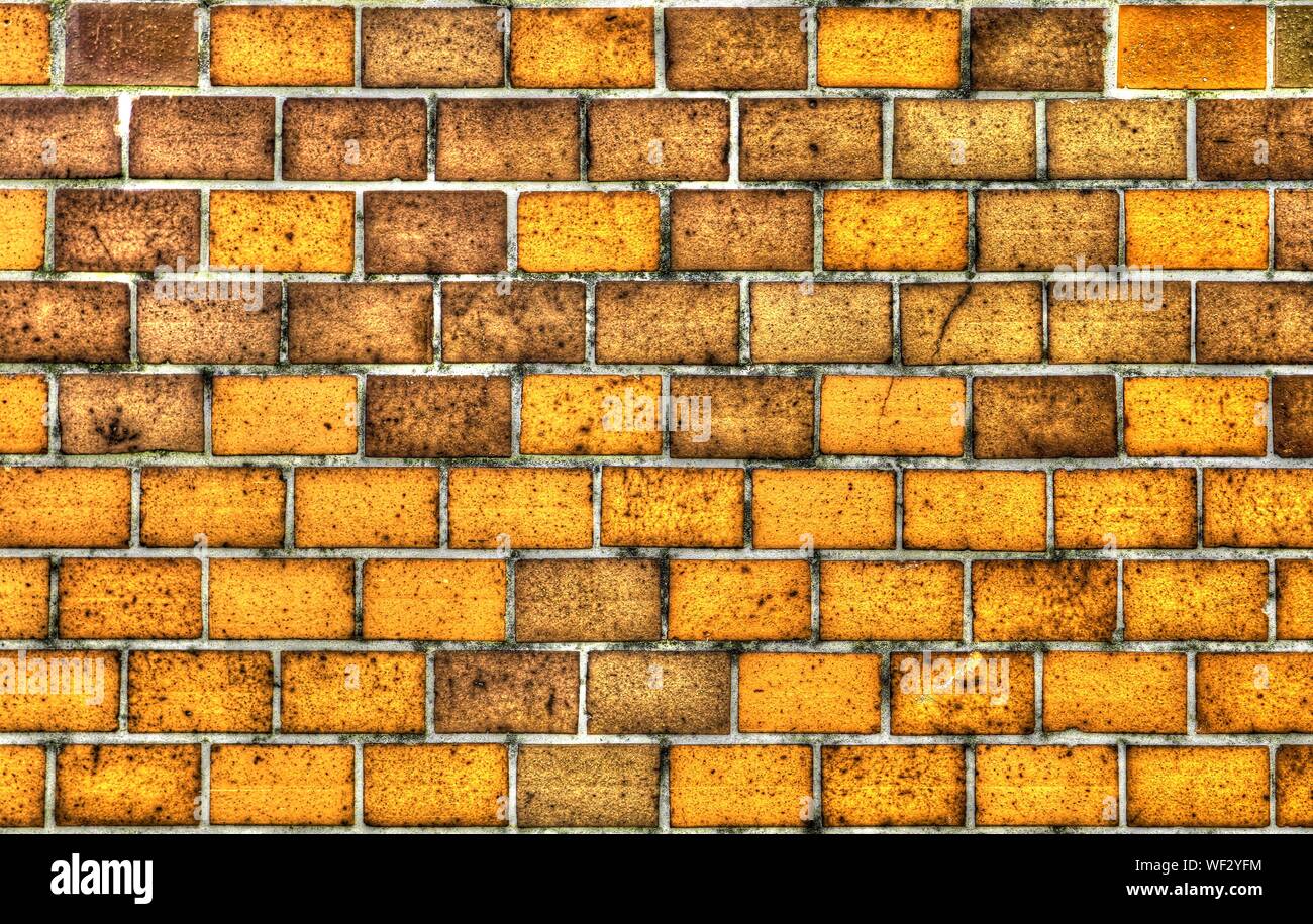 Very detailed texture of yellow brick walls on aged and weathered ...