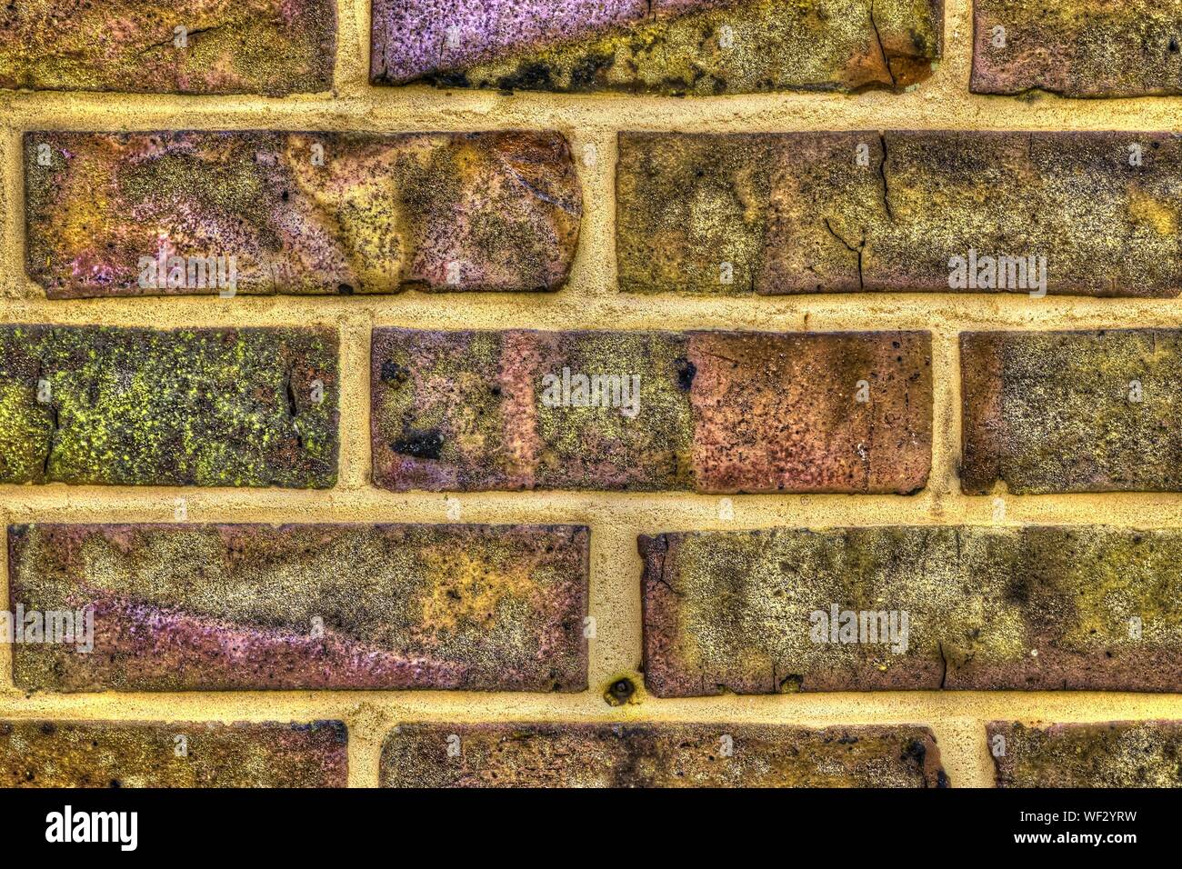 Very detailed texture of yellow brick walls on aged and weathered ...