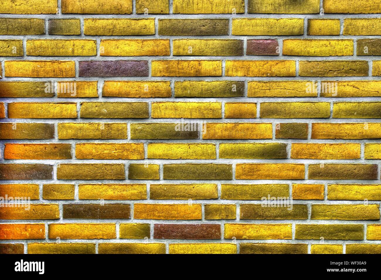 Very detailed texture of yellow brick walls on aged and weathered ...