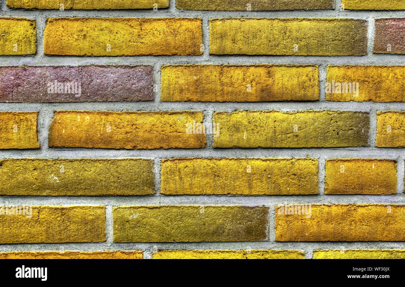 Very detailed texture of yellow brick walls on aged and weathered ...