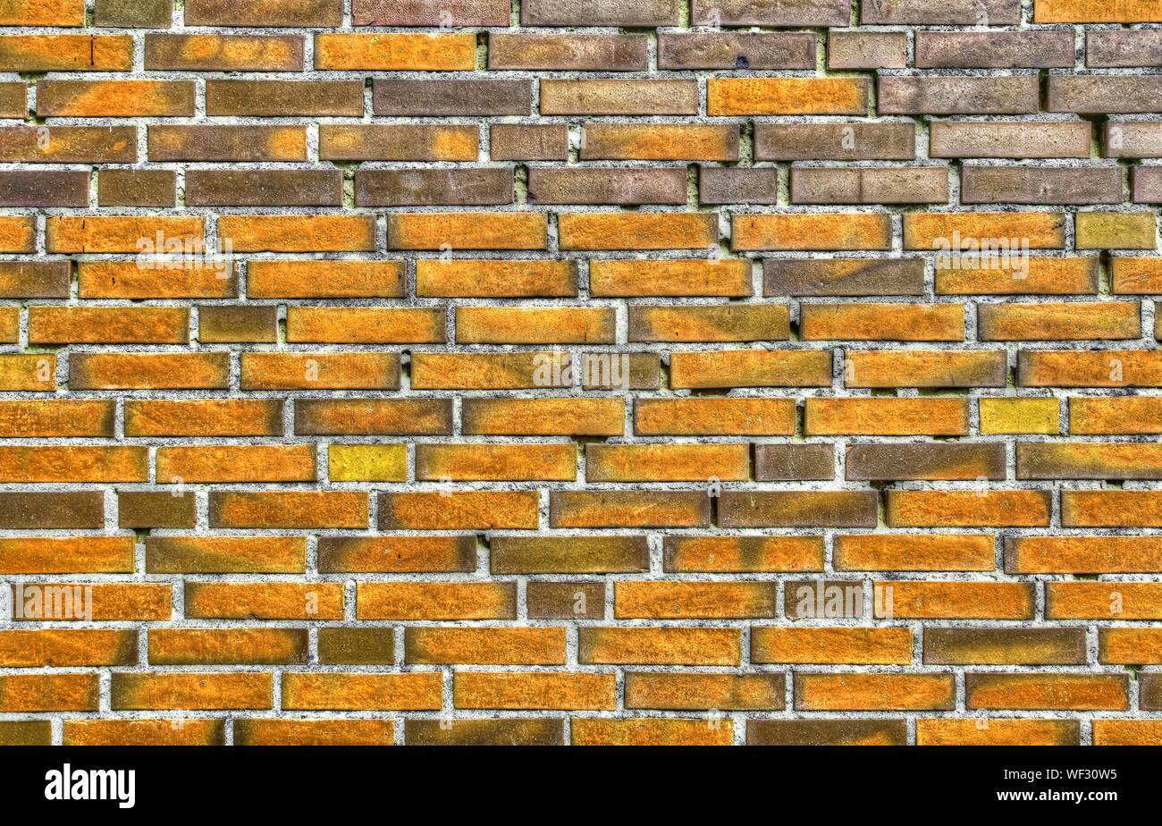 Very detailed texture of yellow brick walls on aged and weathered ...