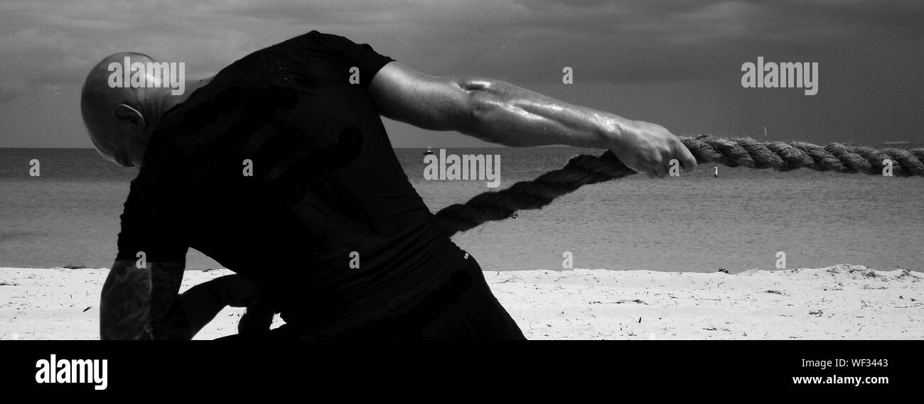 Rope pulling Black and White Stock Photos & Images - Alamy