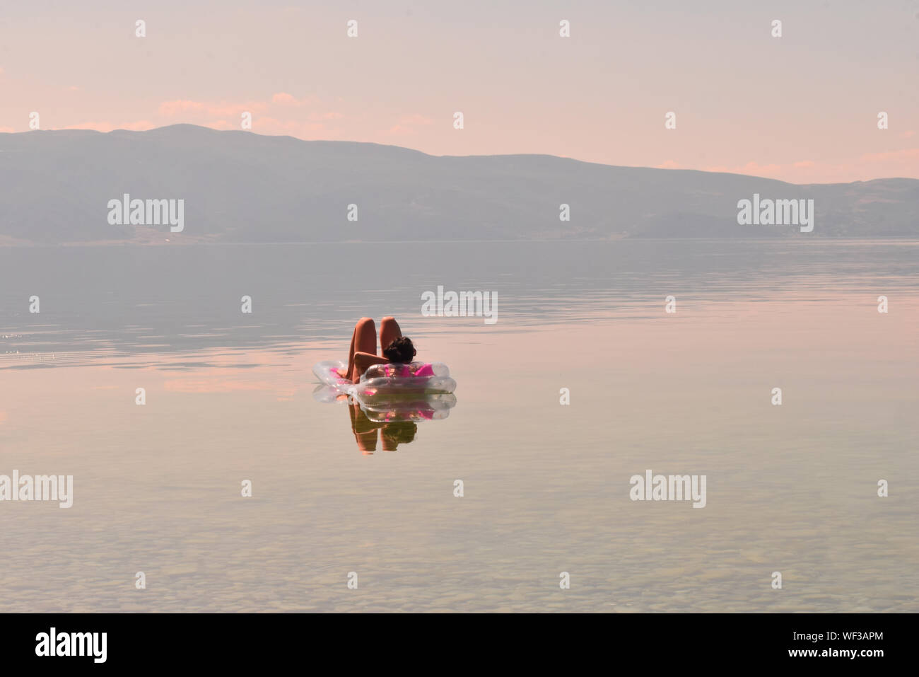 Woman float sea hi-res stock photography and images - Alamy