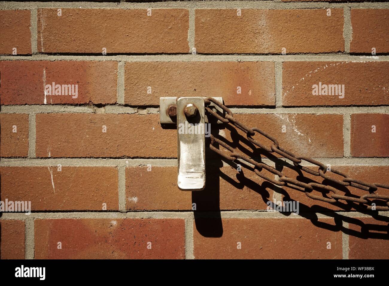 Attached to brick wall hi-res stock photography and images - Alamy