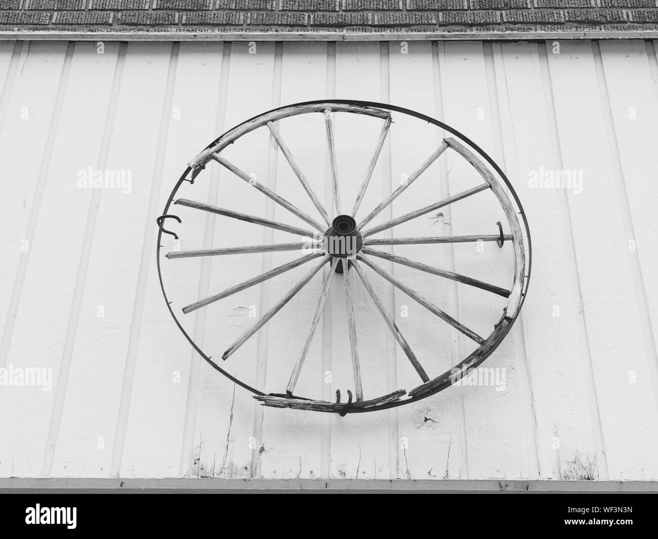 The wheel hanging on the wall hi-res stock photography and images - Alamy