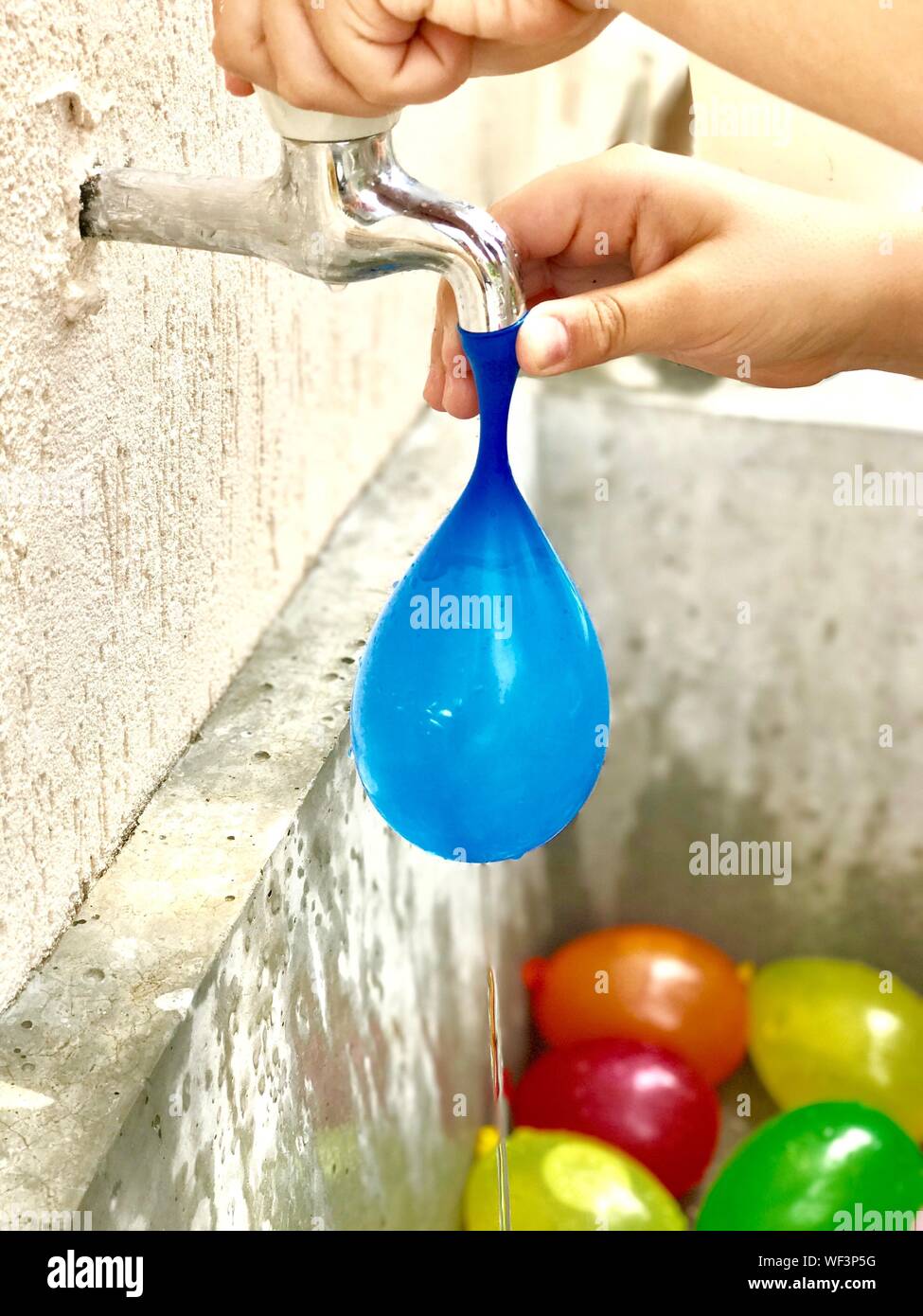 Hand with balloon hi-res stock photography and images - Alamy