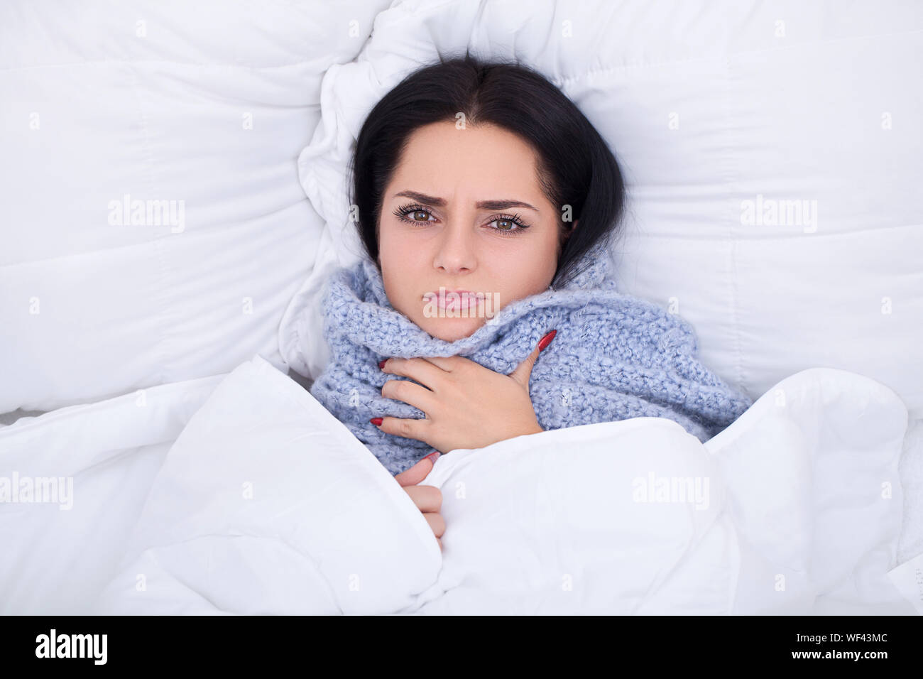 Flu. Sick young woman resting in the bed at home Stock Photo - Alamy