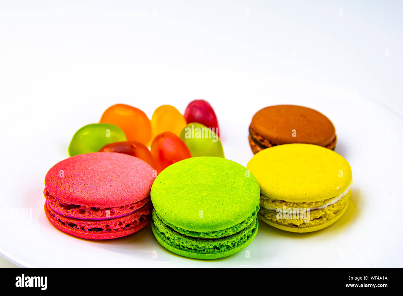 Round color cookies and marmalade on a white background. Dessert ...