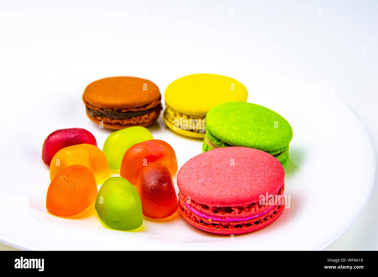 Round color cookies and marmalade on a white background. Dessert ...