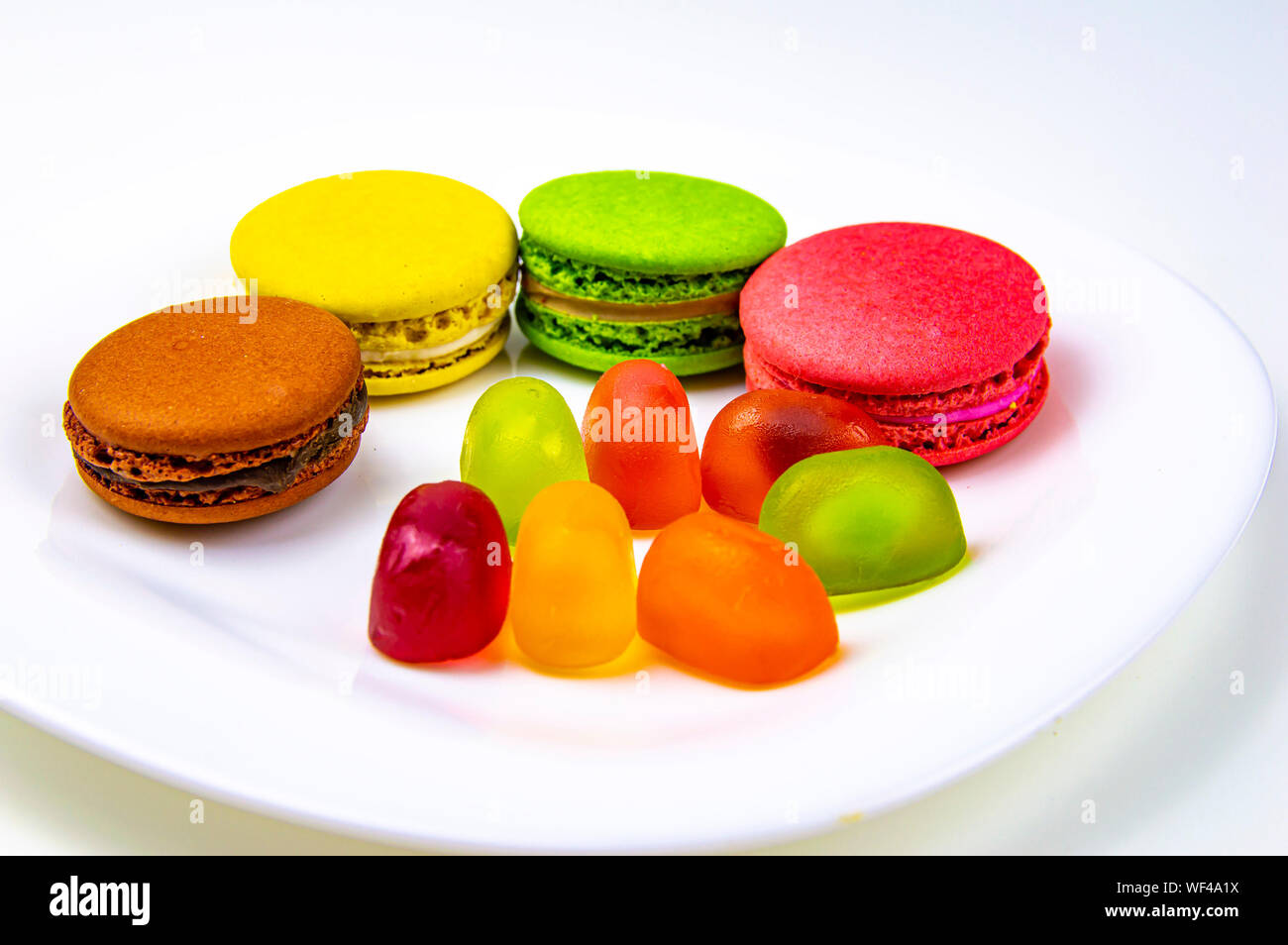 Round color cookies and marmalade on a white background. Dessert ...