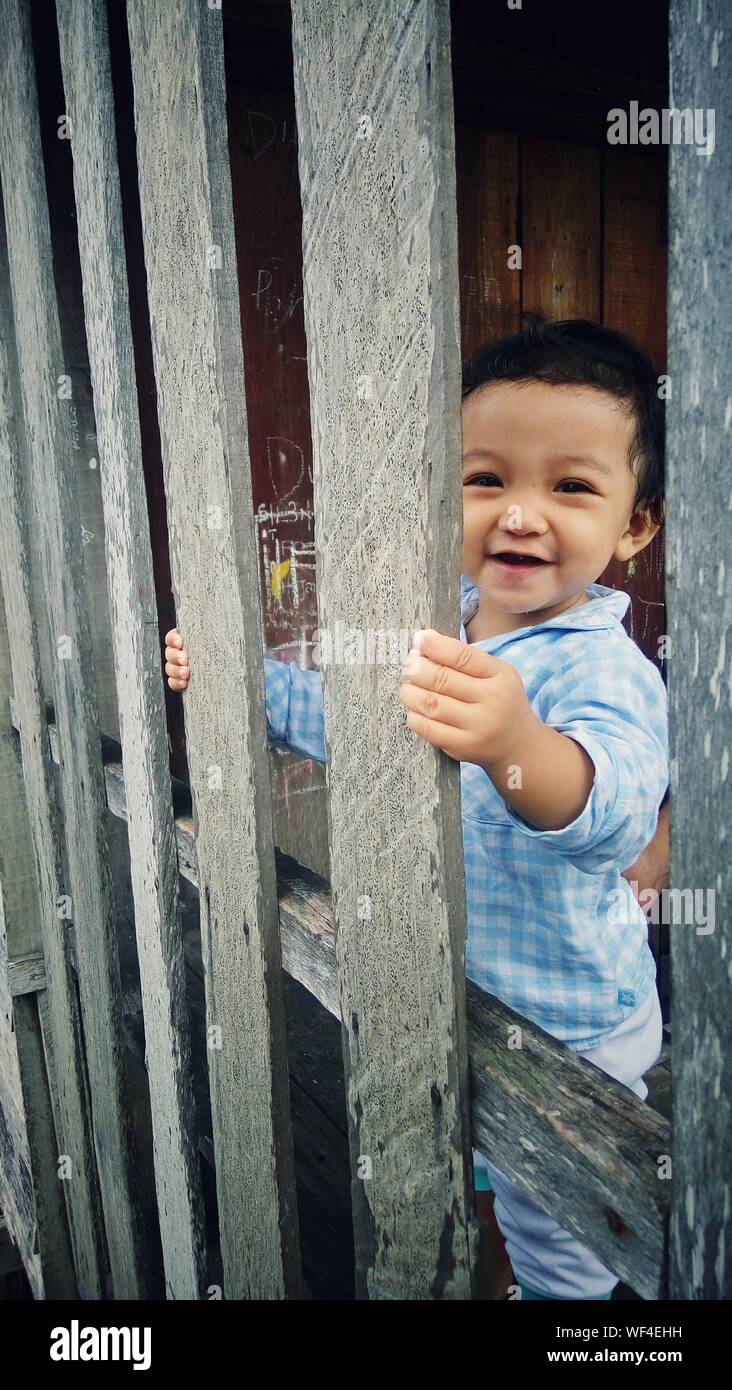 Boy behind the fence hi-res stock photography and images - Alamy
