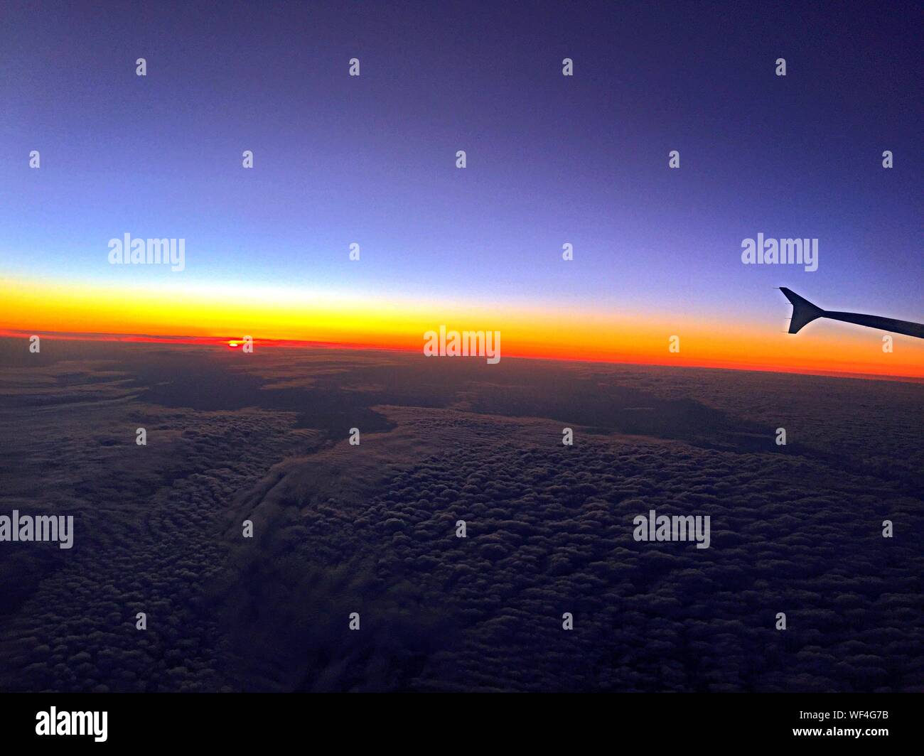 Aircraft Wing Above Land At Dusk Stock Photo - Alamy