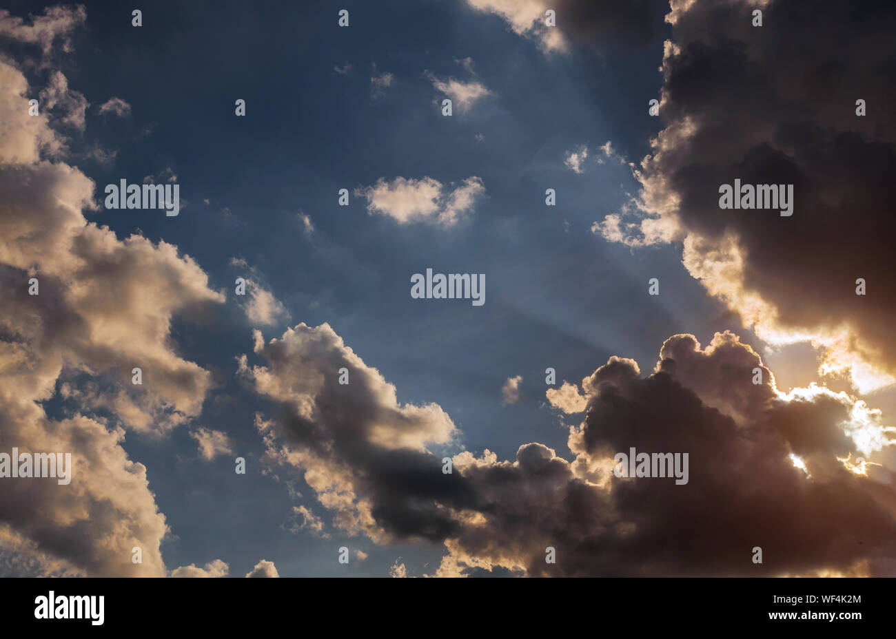 Atmospheric effect sunset with clouds, light rays Stock Photo - Alamy