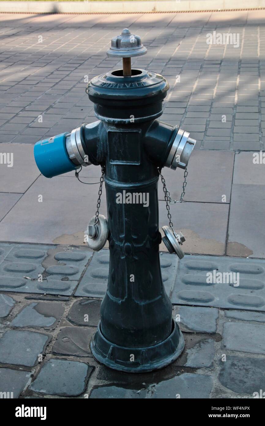 Fire Hydrant At Sidewalk In City Stock Photo - Alamy