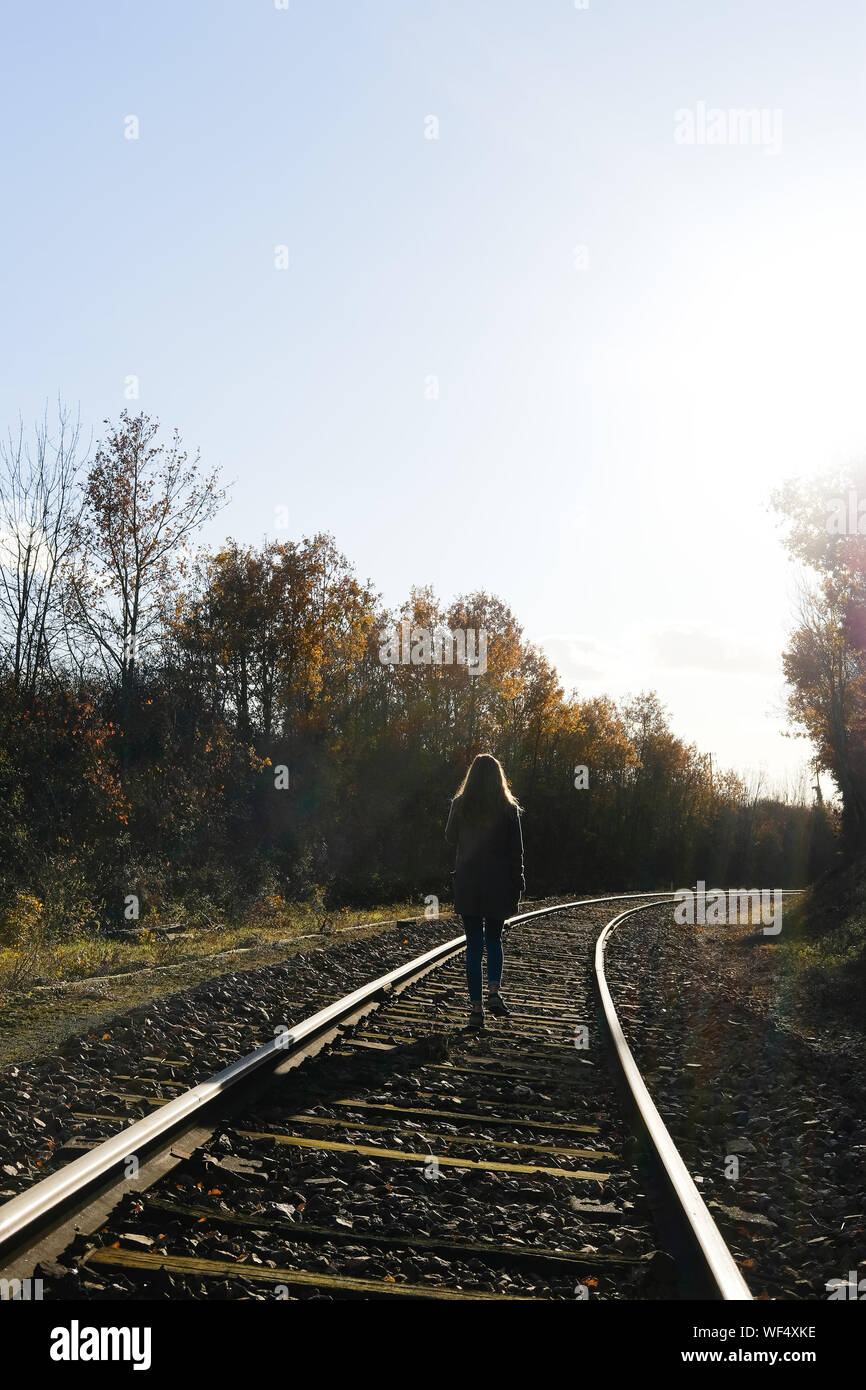 Woman walking on railway track hi-res stock photography and images - Alamy