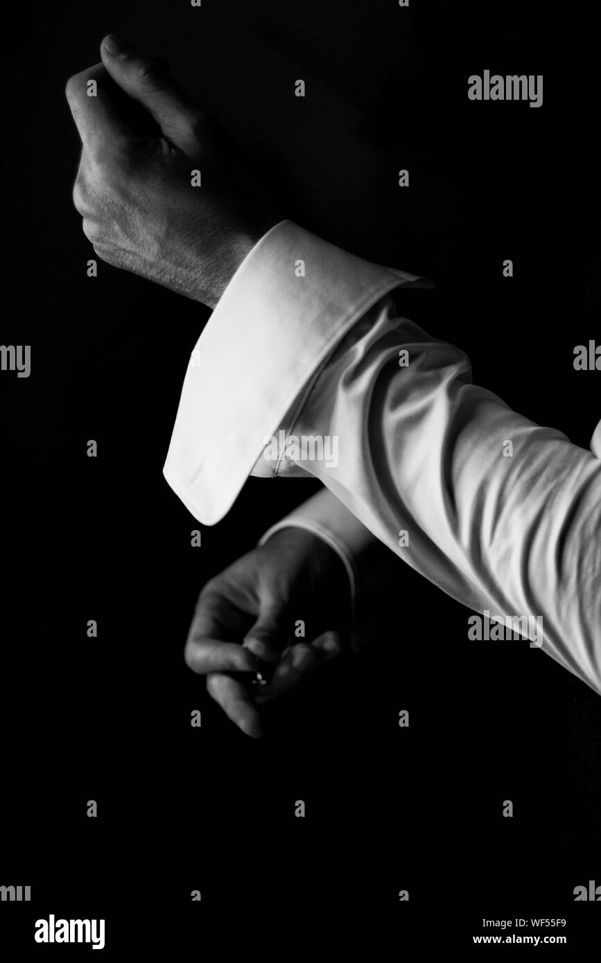 Close up shot of man adjusting his cuff link hi-res stock photography ...