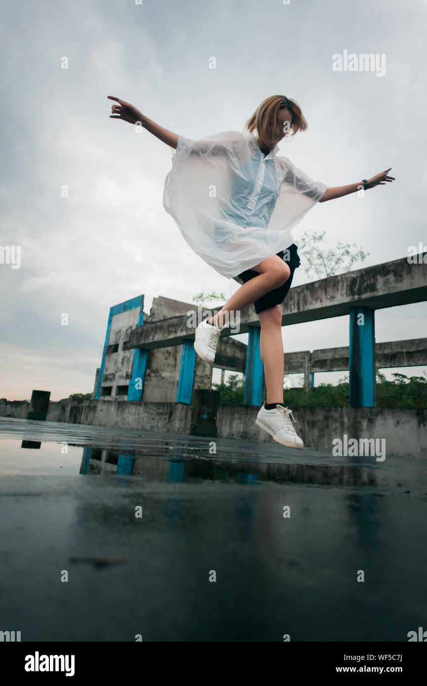 Jumping over puddle hi-res stock photography and images - Alamy