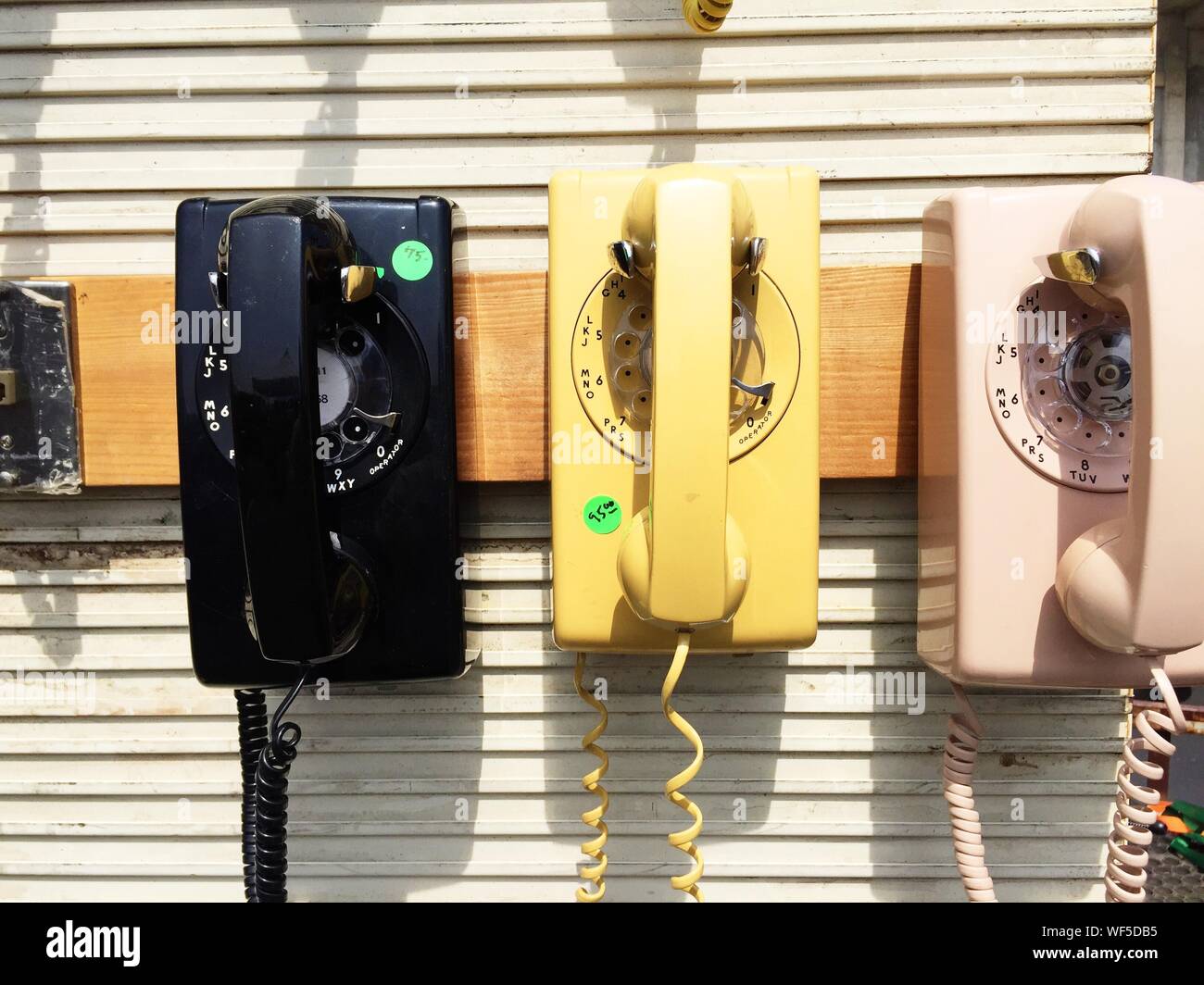 Old telephone mounted on wall hi-res stock photography and images - Alamy