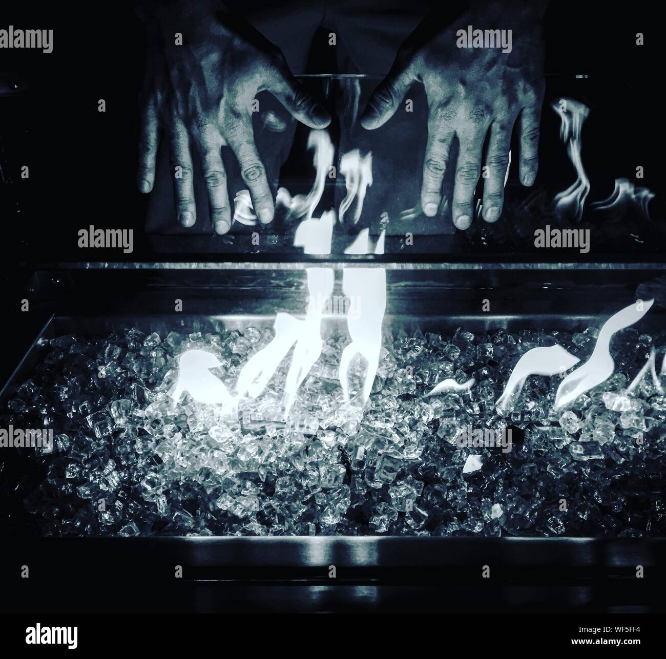 Warming fire hands hi-res stock photography and images - Alamy