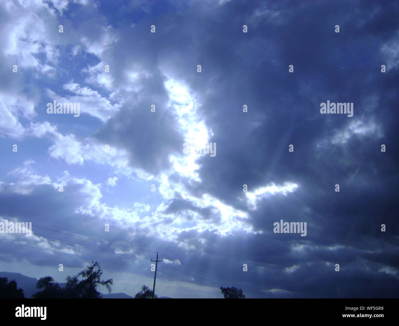 Shining sun with rays hi-res stock photography and images - Alamy