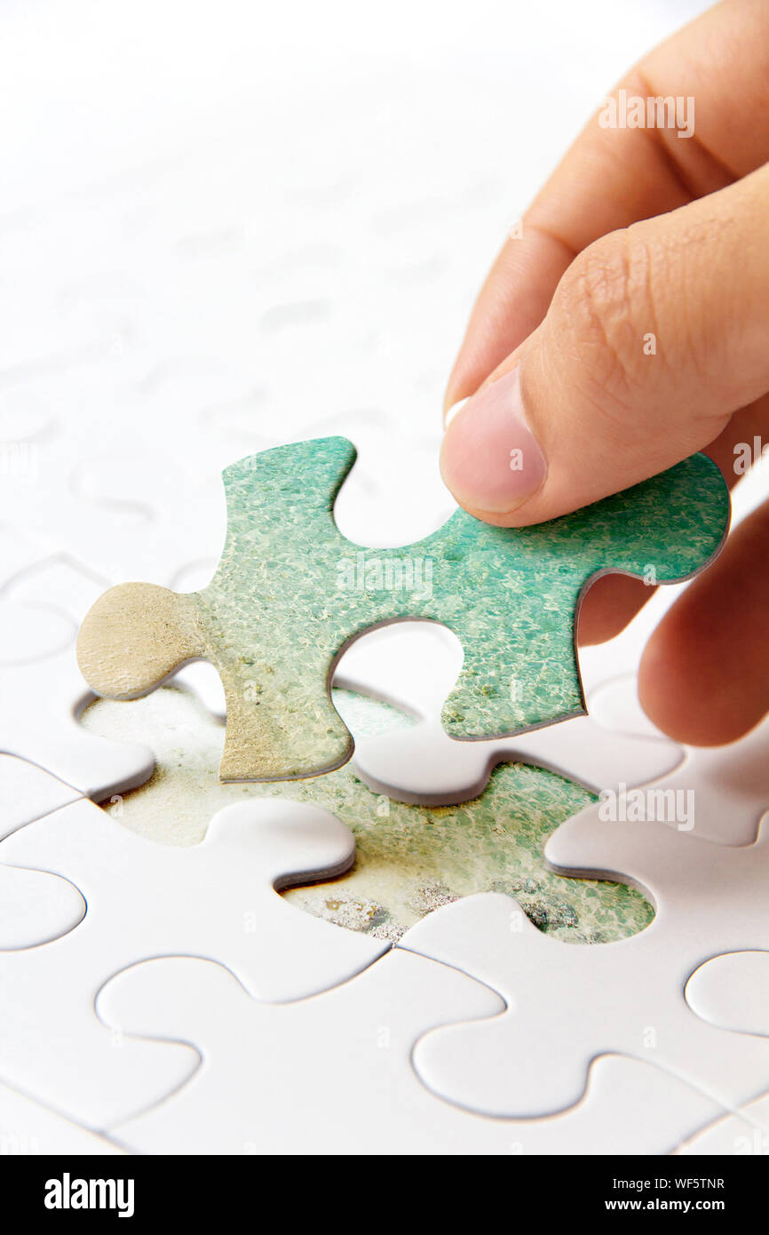 Holding puzzle piece hi-res stock photography and images - Alamy