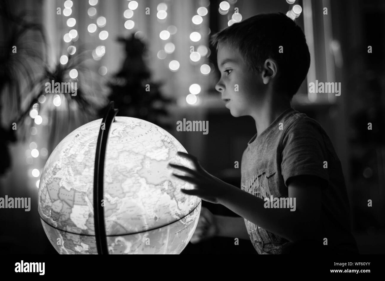 Boy looking at map Black and White Stock Photos & Images - Alamy