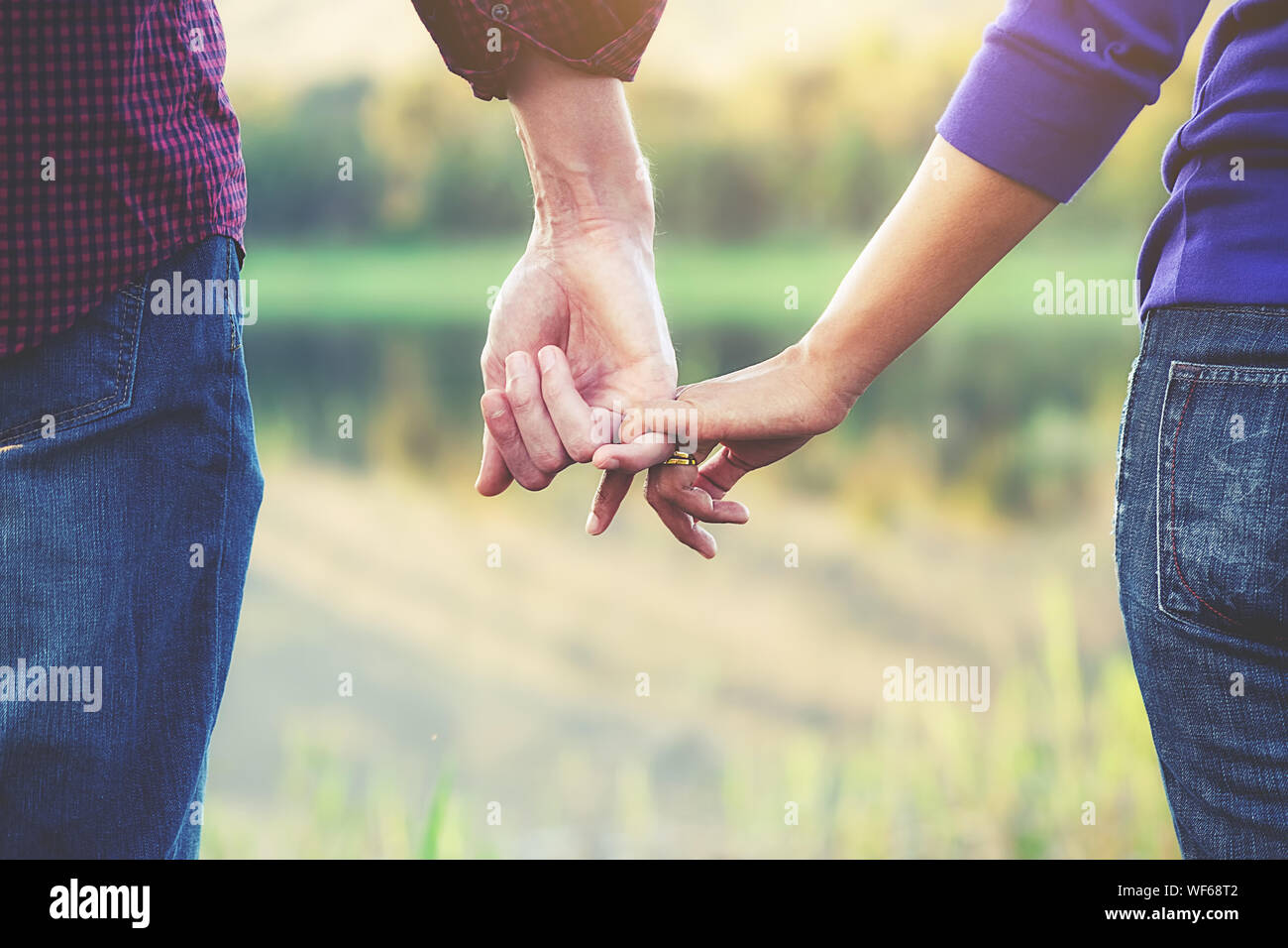 Hands interlocked hi-res stock photography and images - Alamy