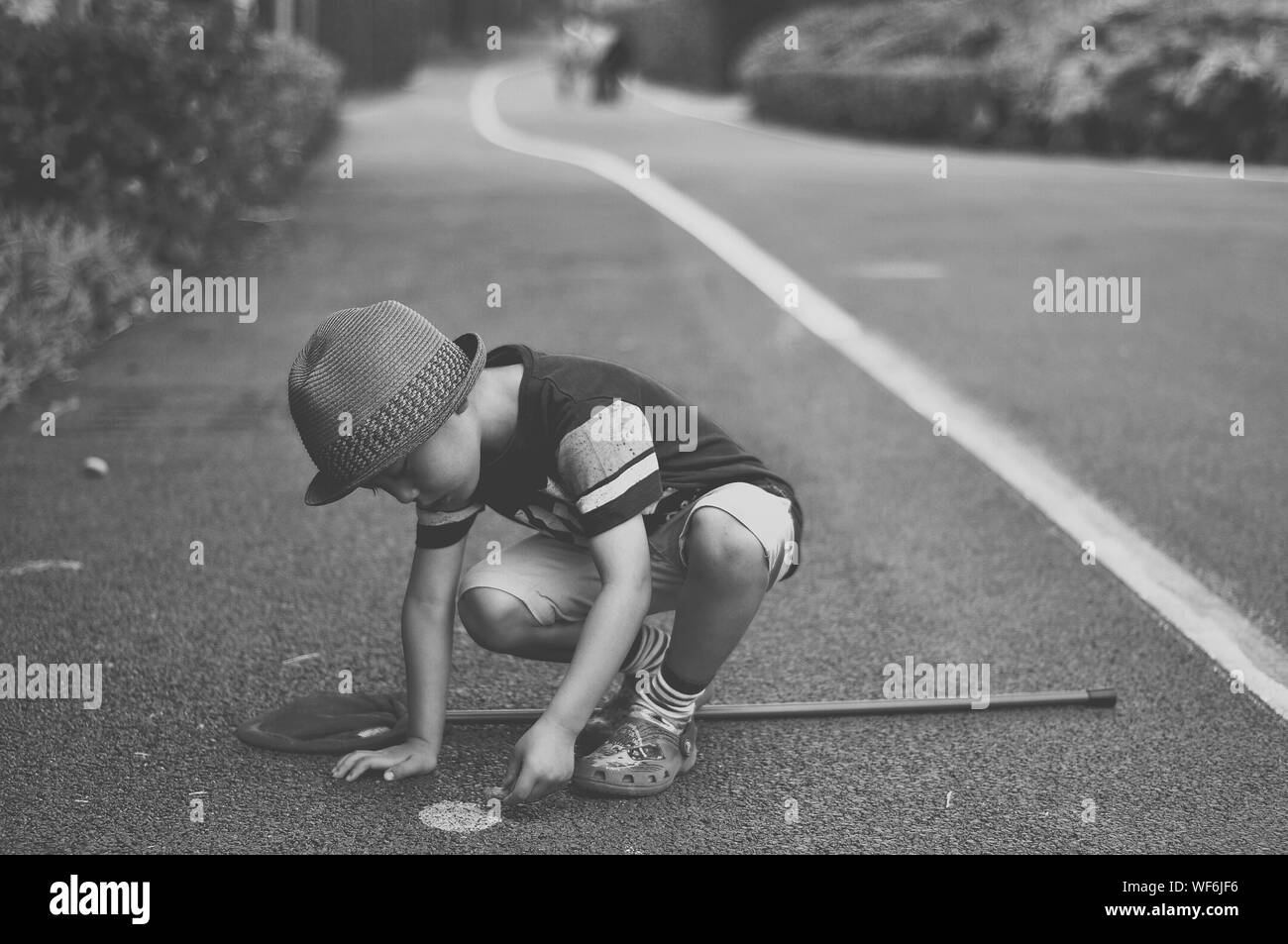Child playing in the road hi-res stock photography and images - Alamy