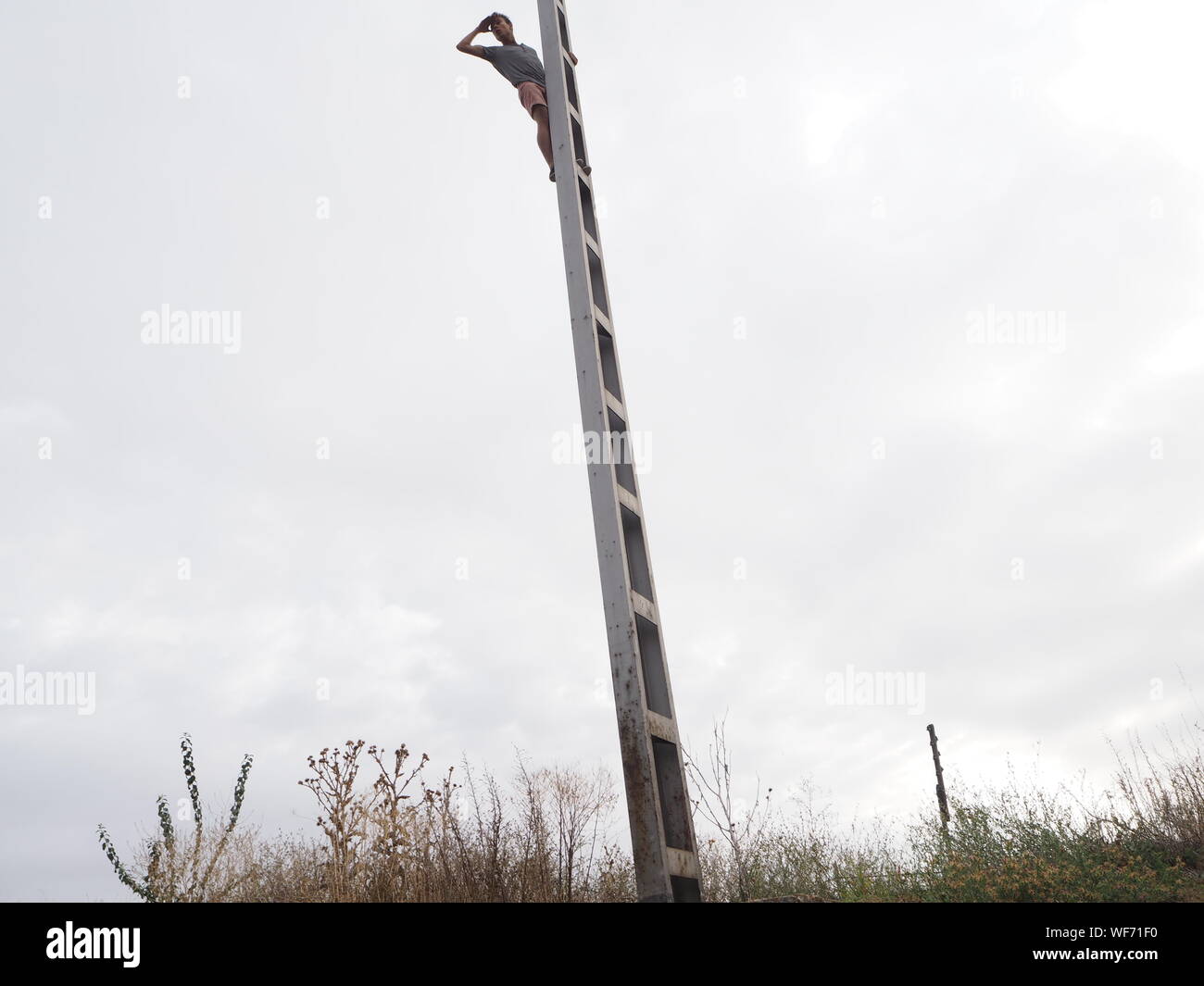 Real people on ladder hi-res stock photography and images - Alamy