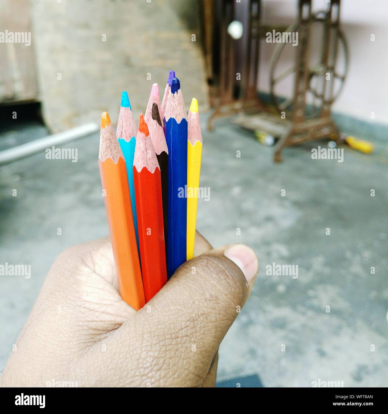 Cropped hand holding colored pencils hi-res stock photography and ...