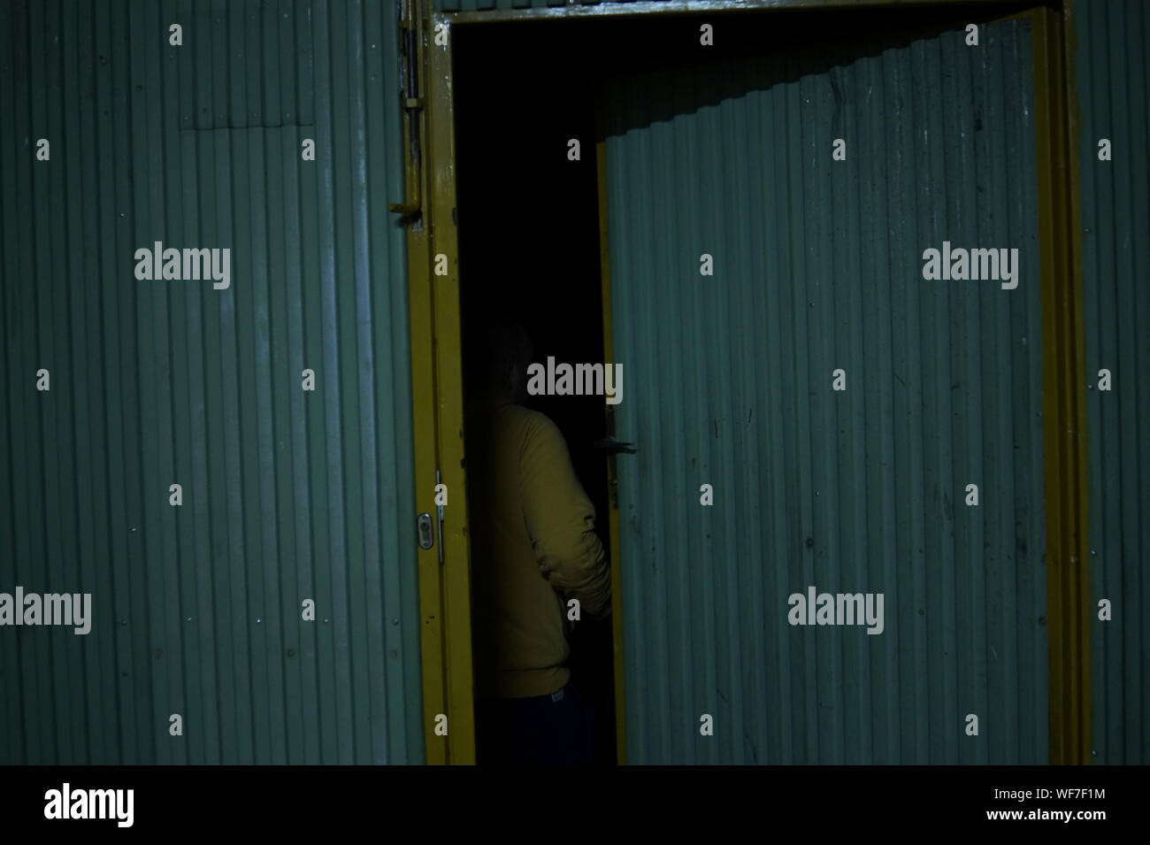 Man entering door hi-res stock photography and images - Alamy