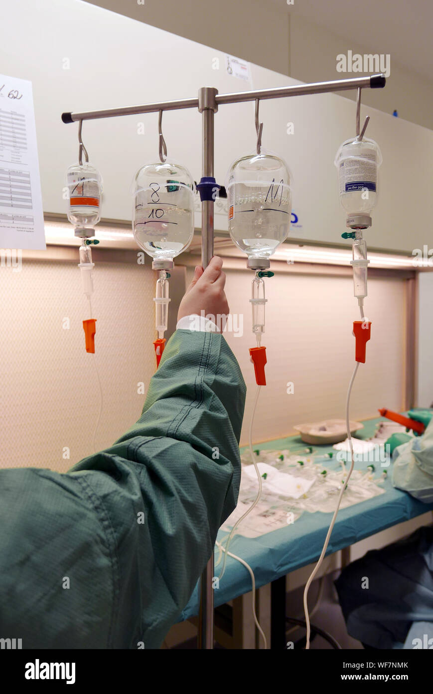 Human hand on iv drip hi-res stock photography and images - Alamy