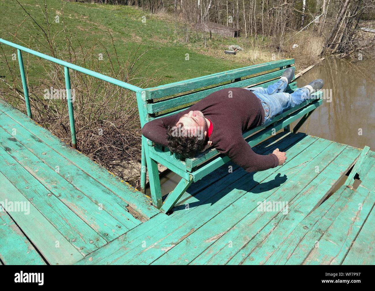Man lying on bench hi-res stock photography and images - Alamy