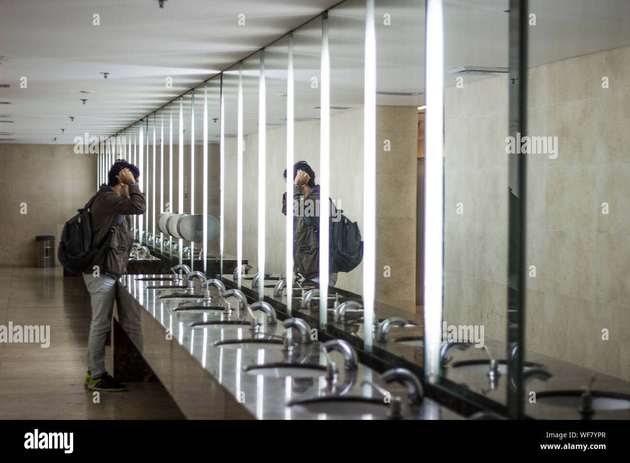 Public bathroom mirror man hi-res stock photography and images - Alamy
