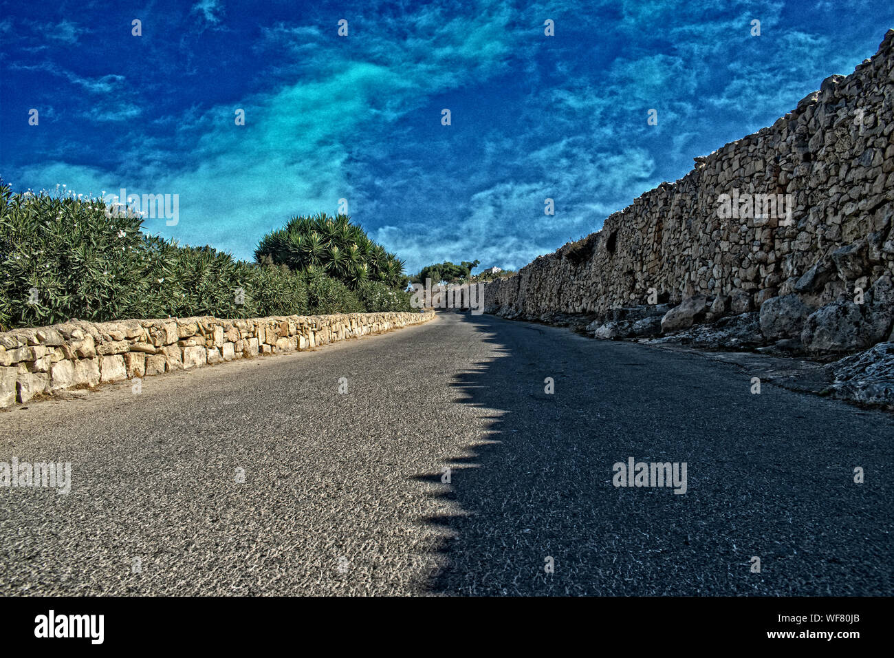 A quite empty road in Gharghur, Malta featuring typical Maltese ...
