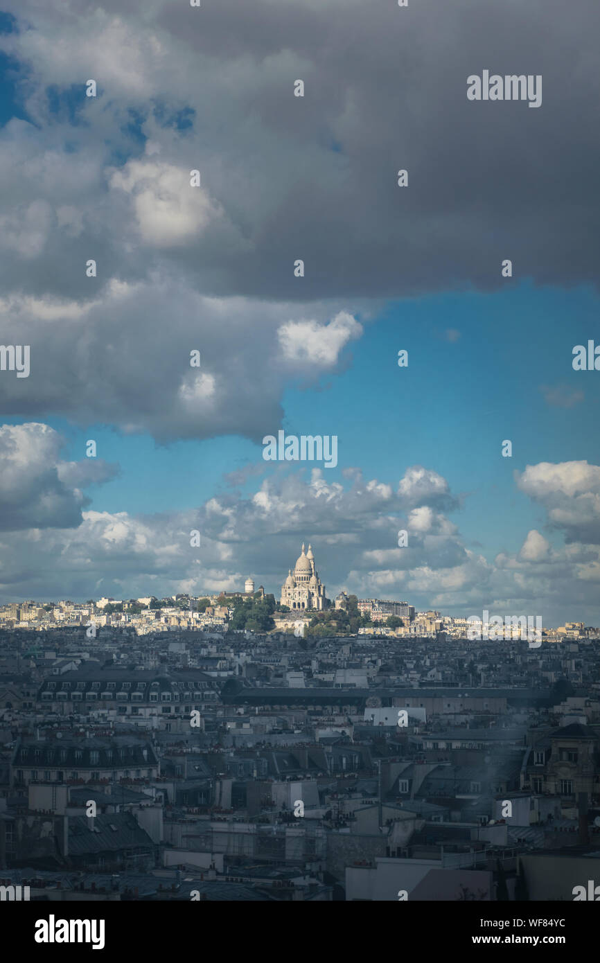 Dramatic view of the city landscape being taken over by shadow while ...