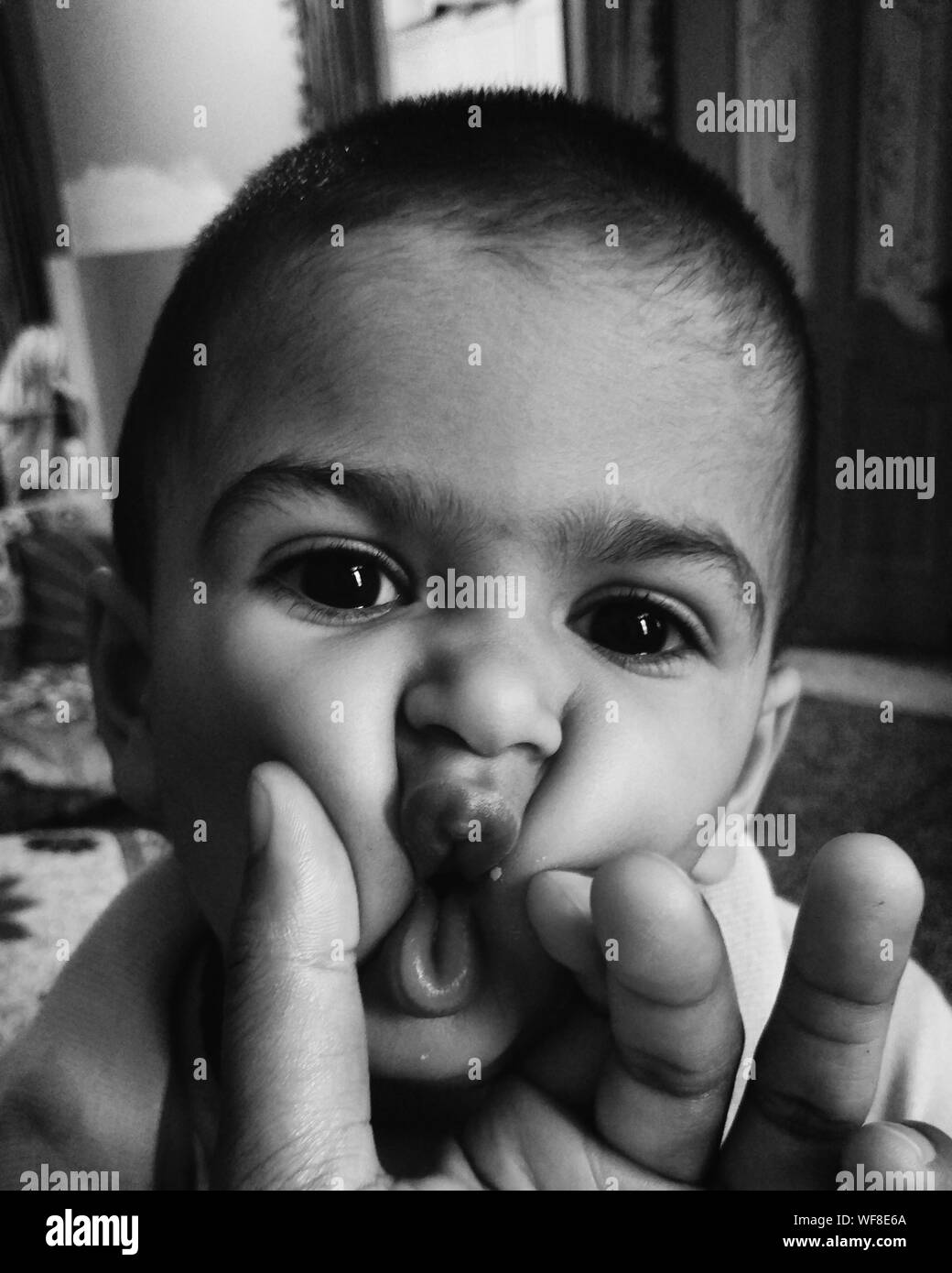 Hand holding face hi-res stock photography and images - Alamy