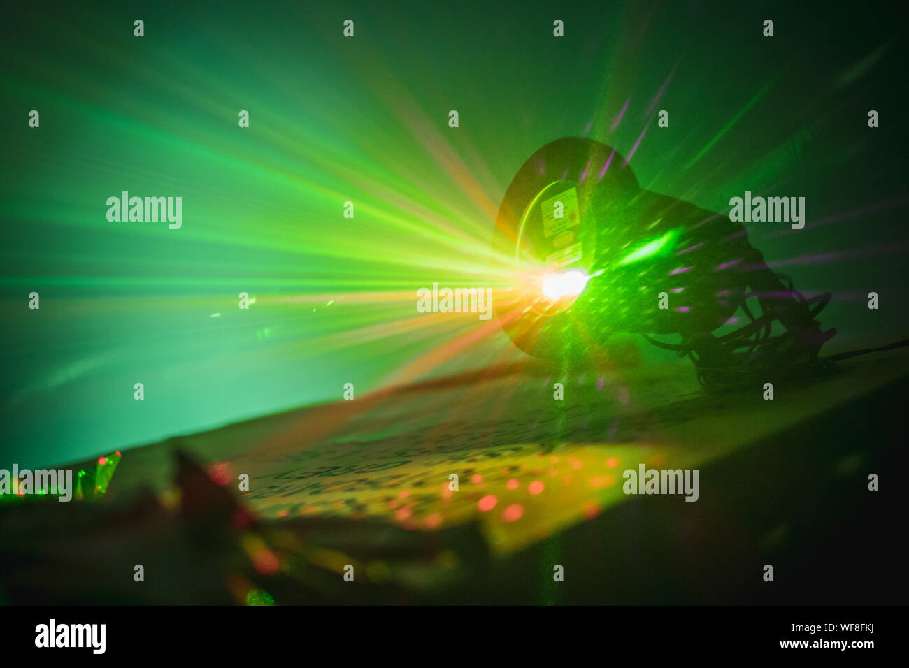 Bright green laser light show in the dark Stock Photo - Alamy