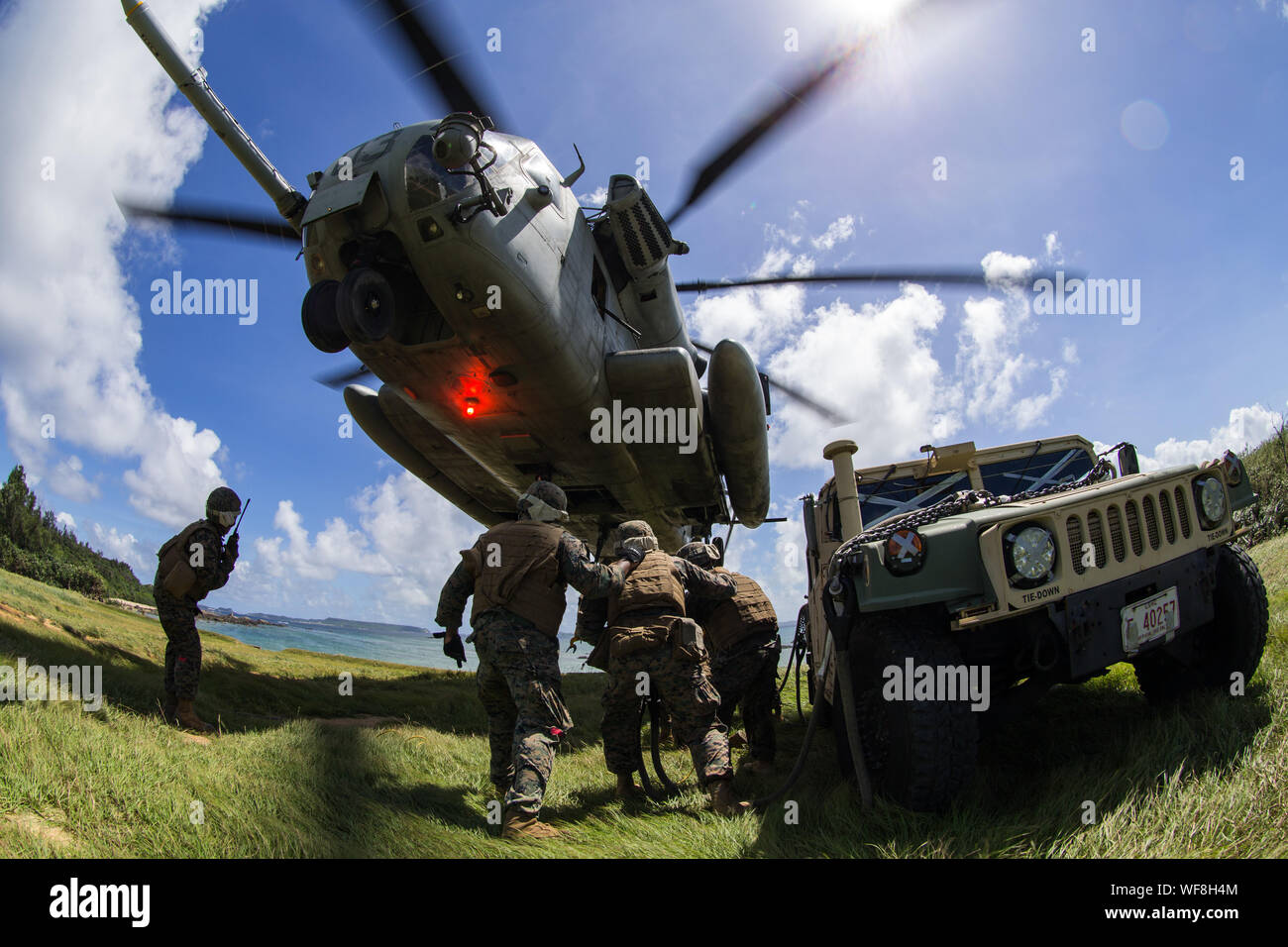 U.S. Marines with Landing Support Platoon rig a tactical vehicle for ...