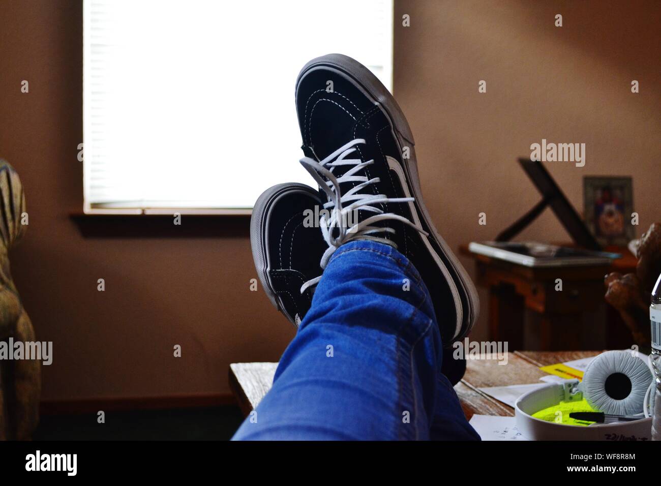 Man sitting with feet up on table hi-res stock photography and images ...