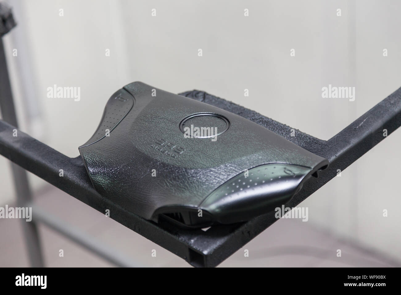 Painting and drying in professional box of car interior part steering ...