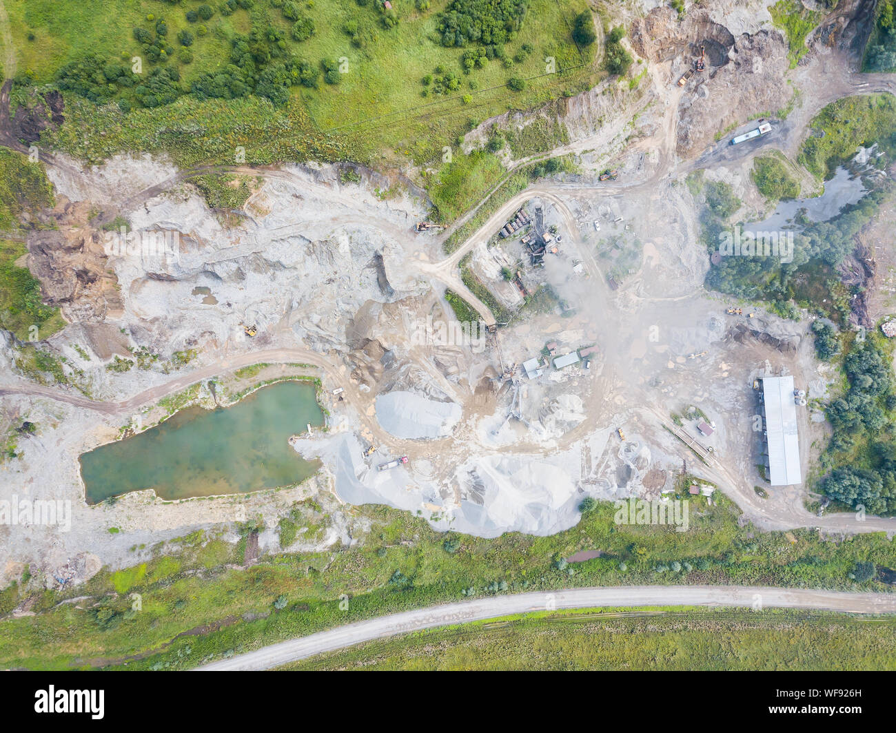 Aerial view of a small plant for the production and cleaning rubble and ...