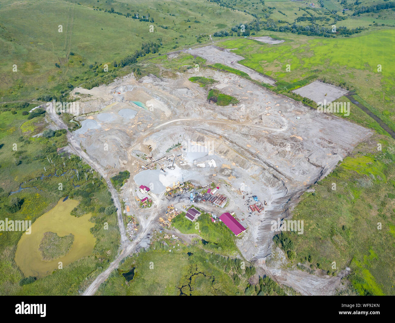 Aerial view of a small plant for the production and cleaning rubble and ...