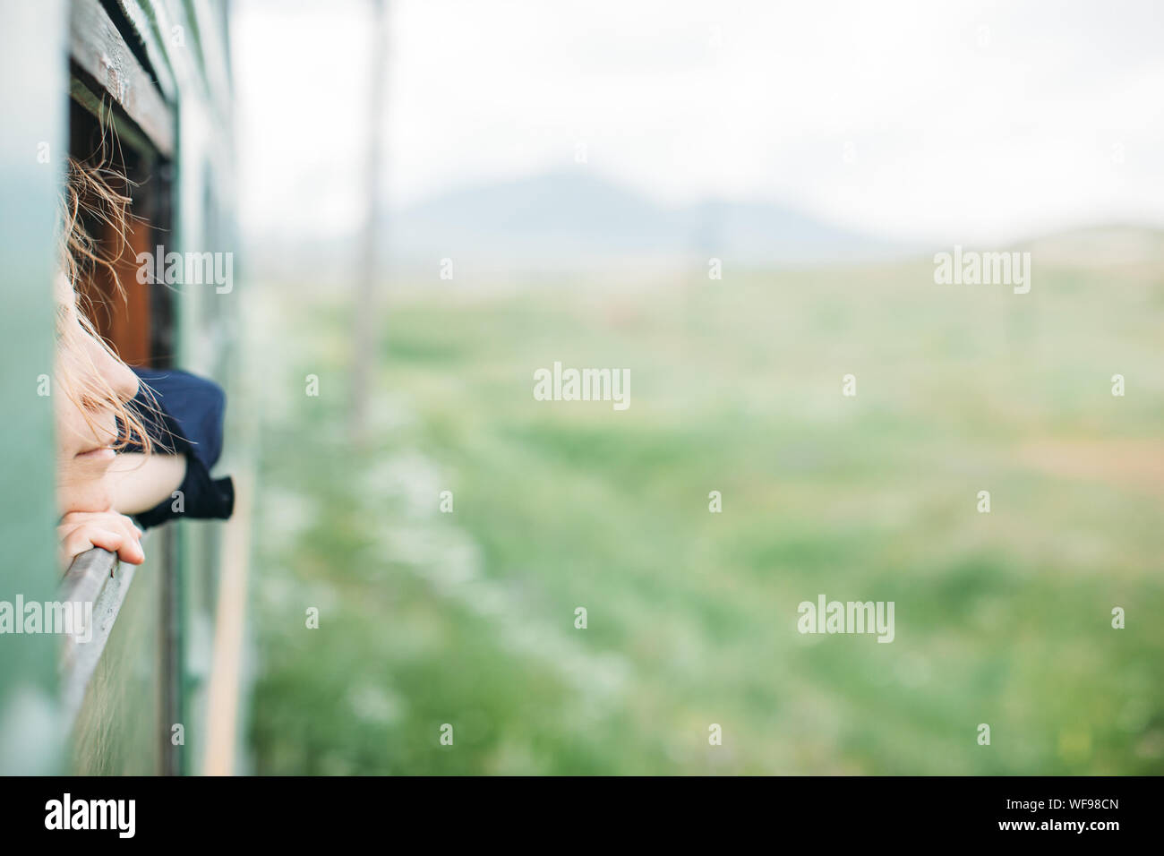 Person looking out train window hi-res stock photography and images - Alamy