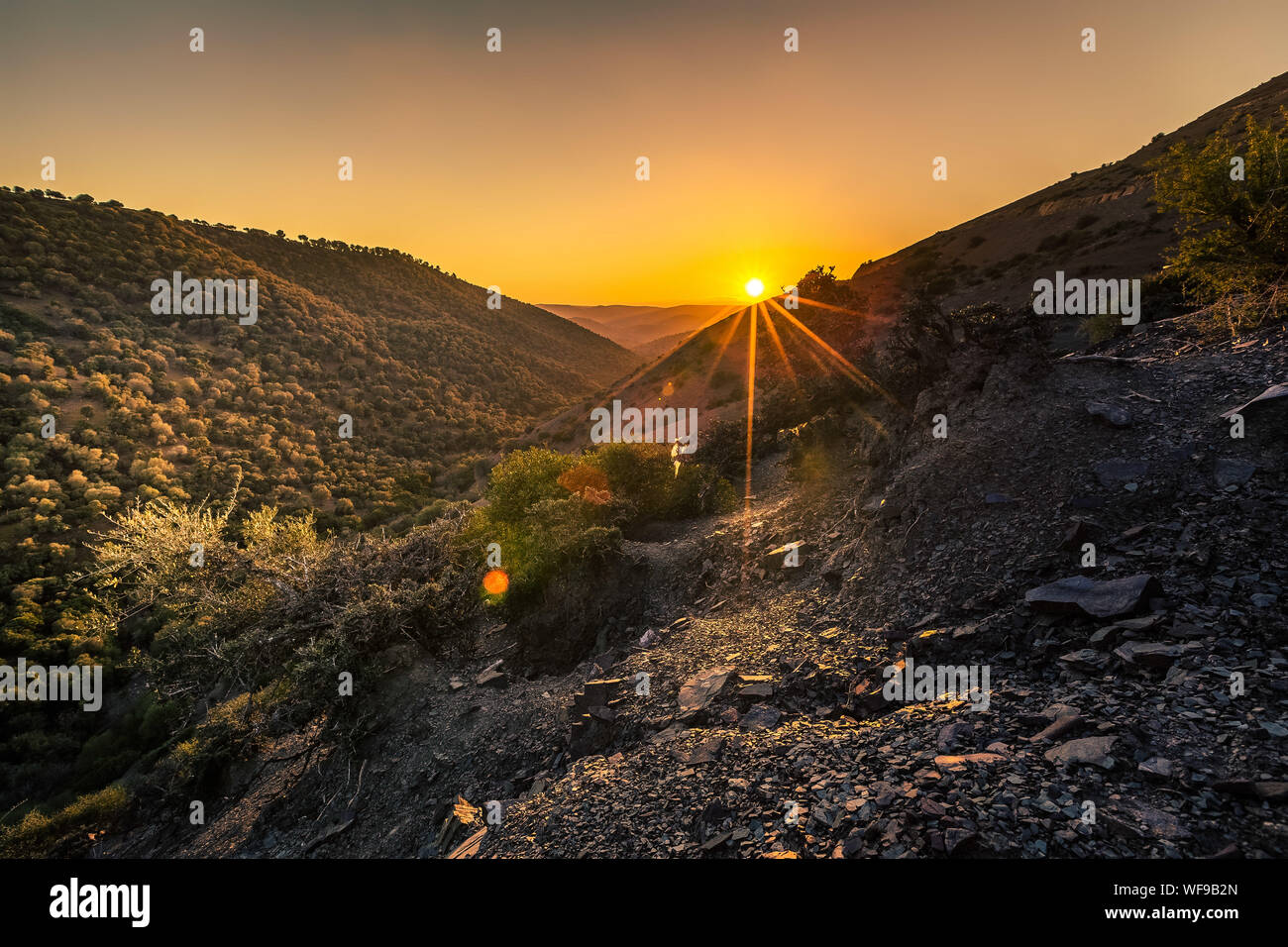 Sun shining over mountains hi-res stock photography and images - Alamy