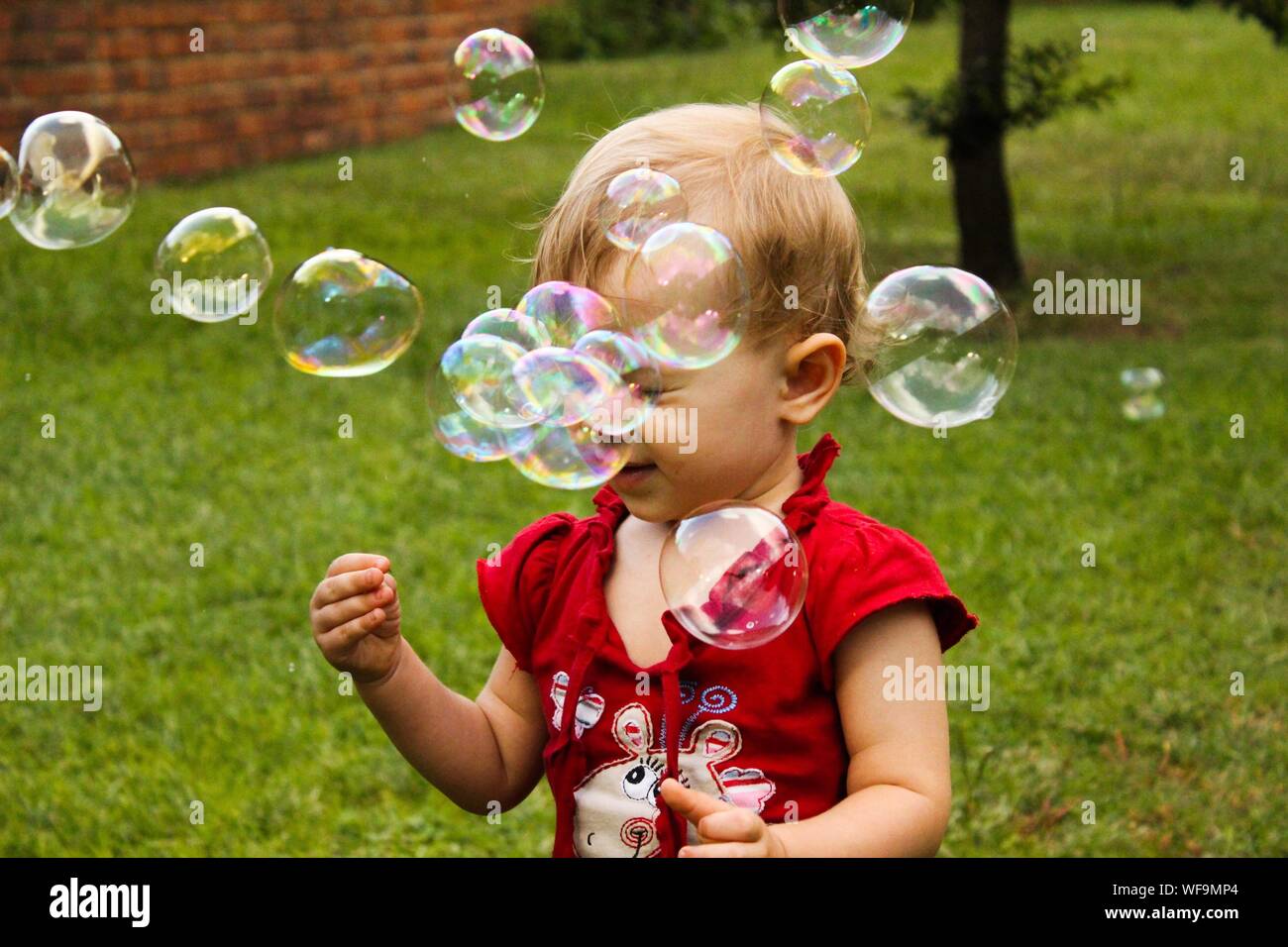 Baby by bubbles hi-res stock photography and images - Alamy