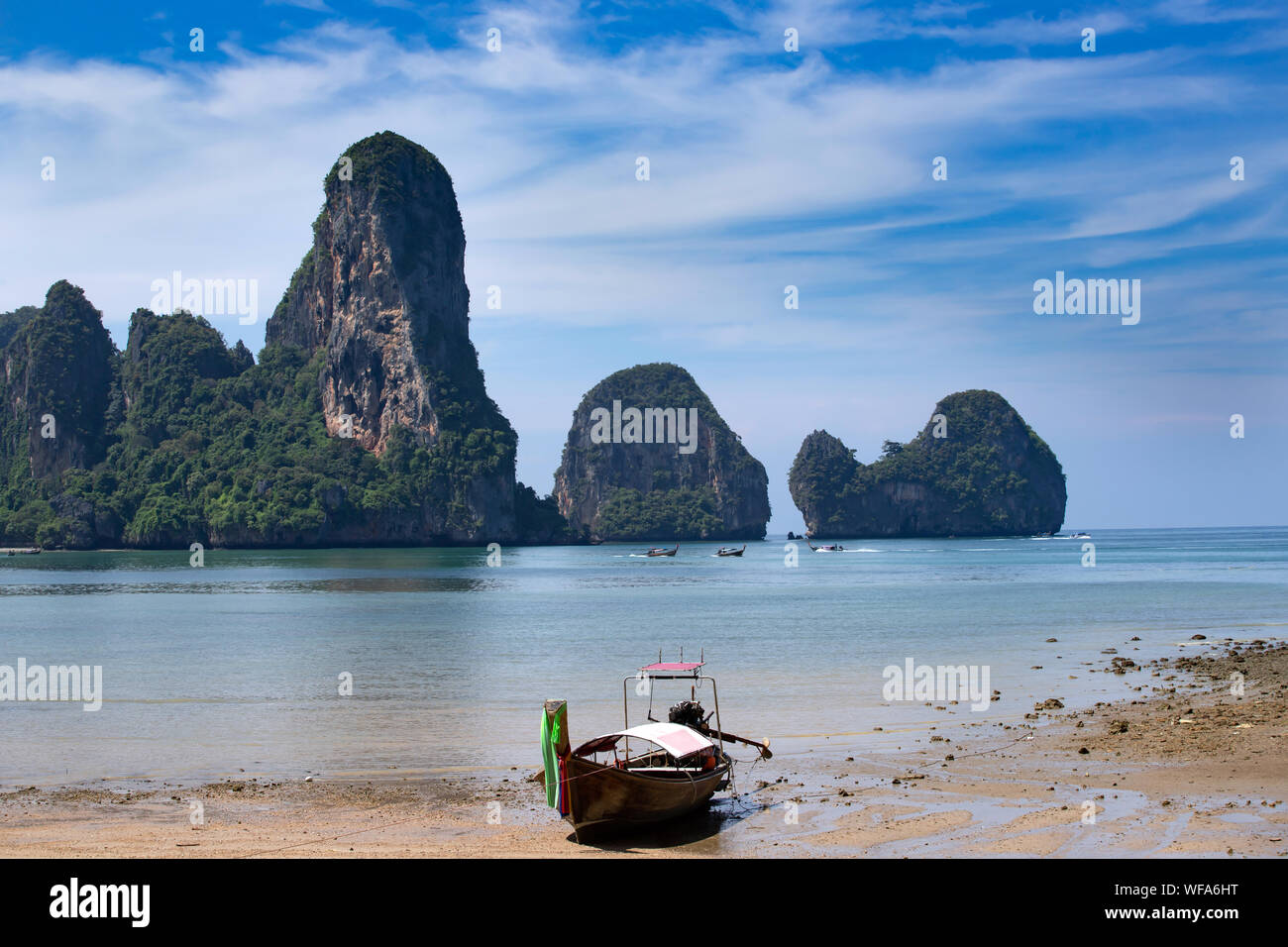 Thai traditional wooden longtail boat and beautiful sand beach at ...