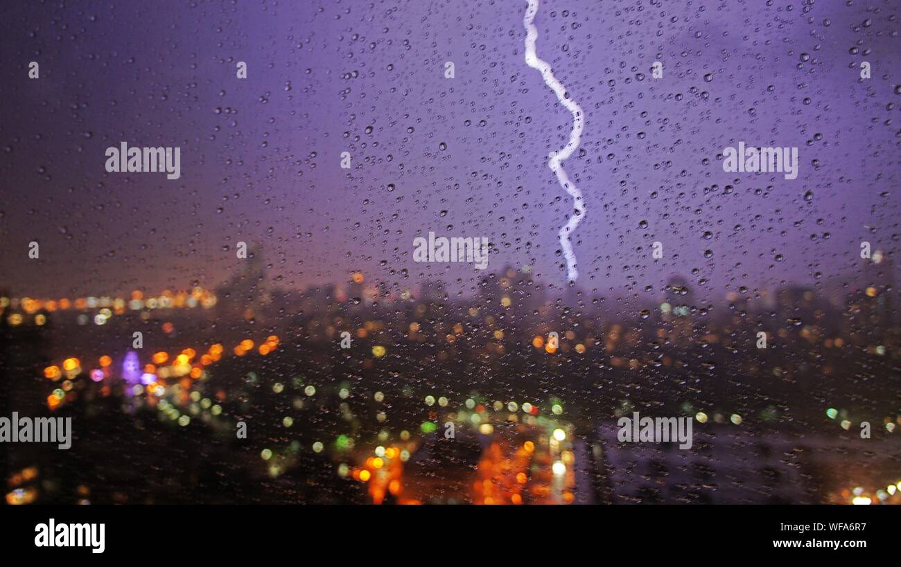 City through rainy window at night hi-res stock photography and images ...