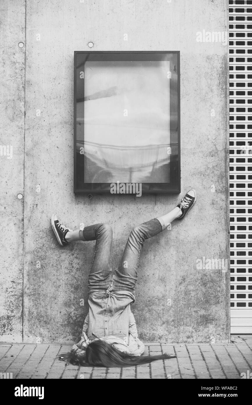 Feet on wall hi-res stock photography and images - Alamy
